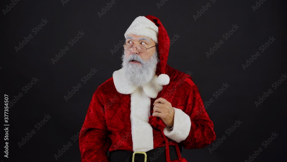 Waist up portrait of Santa Claus in traditional red costume, eyeglasses ...