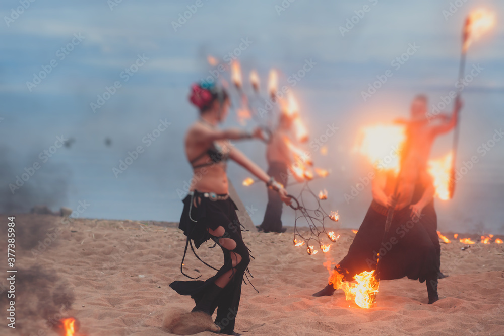 Group of fire artists fakir perform amazing show at night with ...