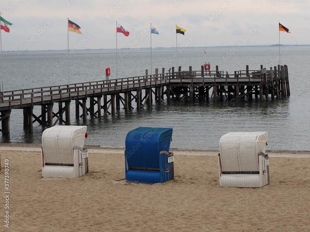 strandkoerbe am strand im sand Stock Photo | Adobe Stock