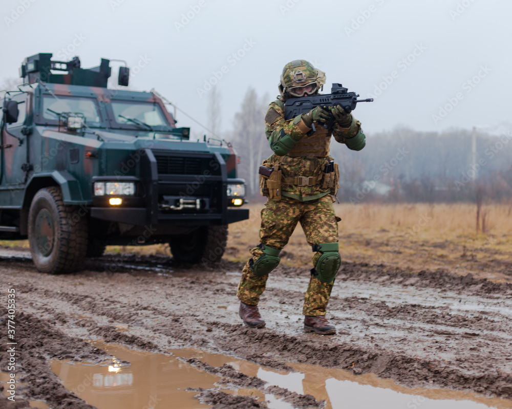 soldier patrolling with a machine gun Stock Photo | Adobe Stock