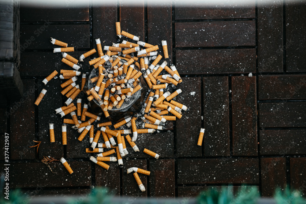 Ashtray Overflowing With Cigarettes Stock Photo | Adobe Stock