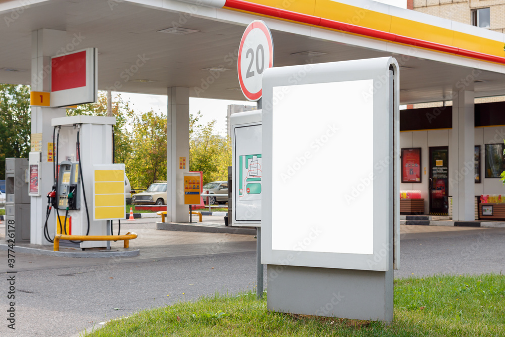 Vertical billboard at the entrance of a gas station, mock up. Stock ...