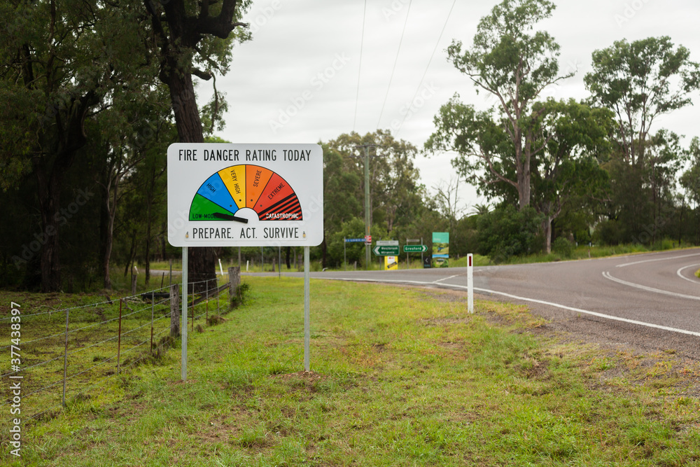 roadside fire danger rating sign near country intersection Stock Photo ...