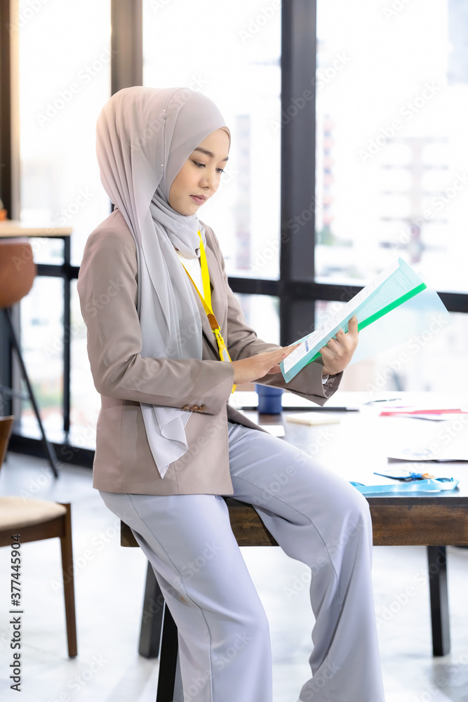 Confident Asia Muslim (Islam) businesswomen executive working in the ...