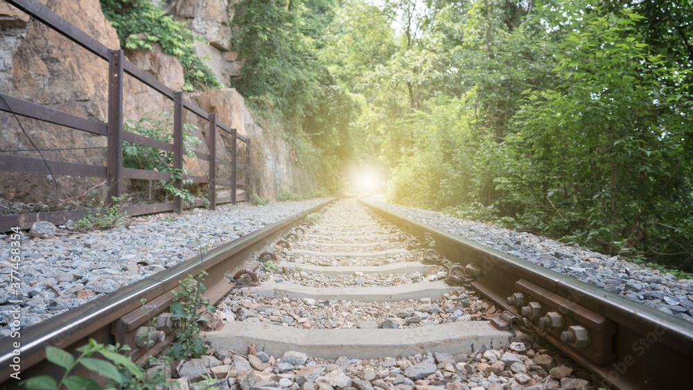 Vintage railroad, railway tracks in a rural scene with golden light at ...