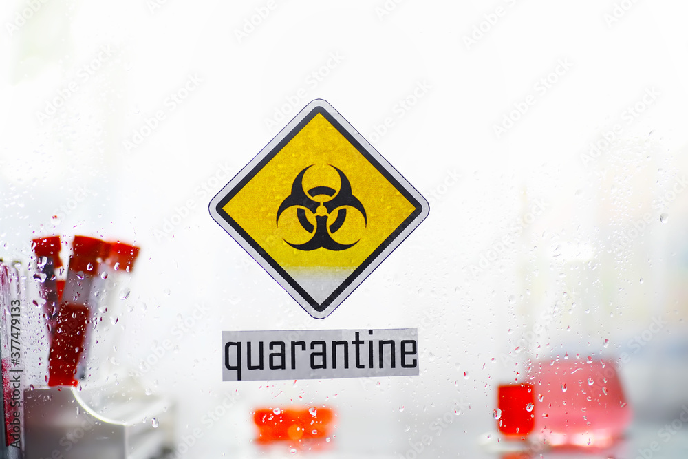Quarantine. Quarantine warning sign on a glass door in a hospital ...