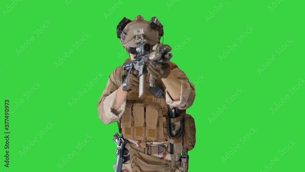 Soldier shoots aming and shooting with rifle on a Green Screen, Chroma ...