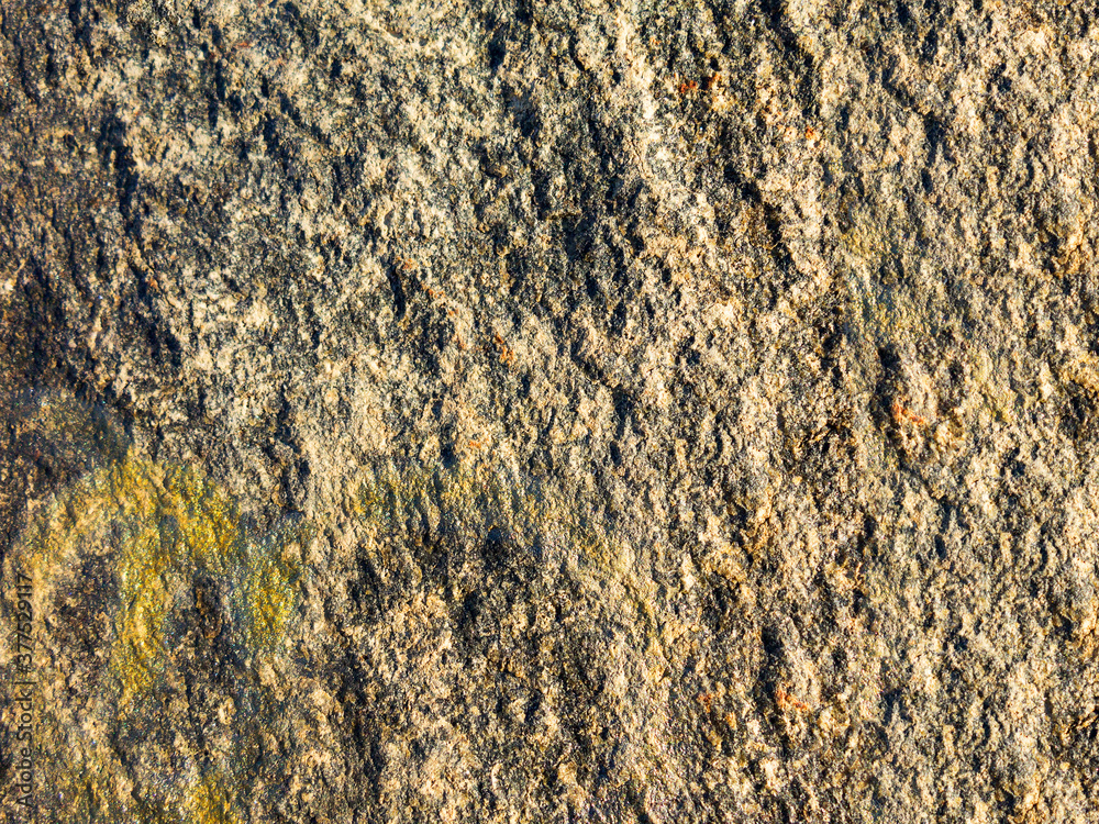 Stone background of mottled granite igneous rock used in construction ...