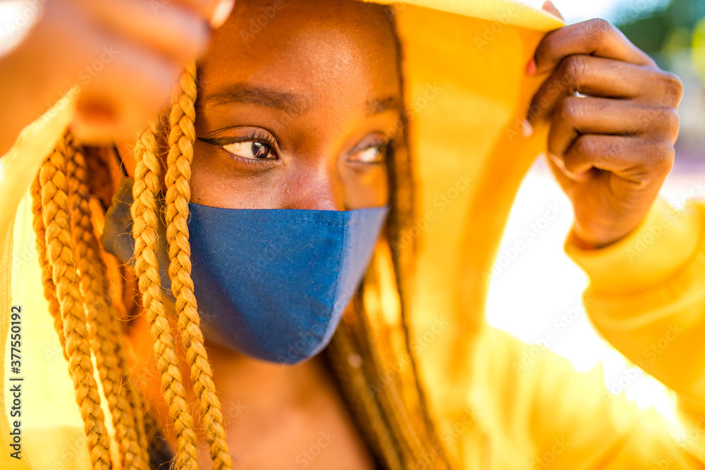 african american woman with long yellow dreadlocks pigtails working out ...