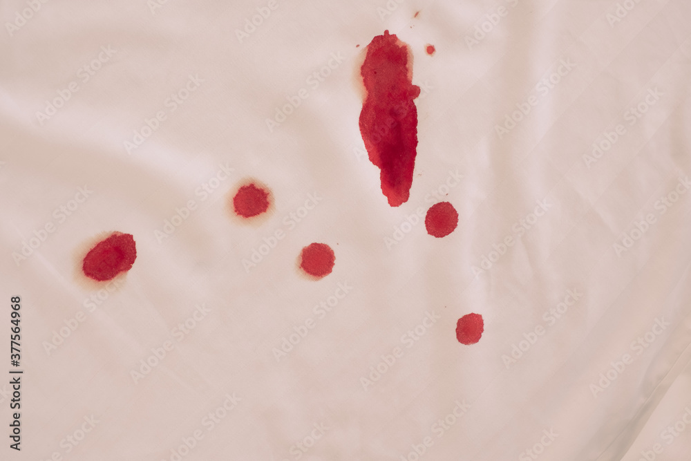 blood stains from menstruation in bed Stock Photo | Adobe Stock