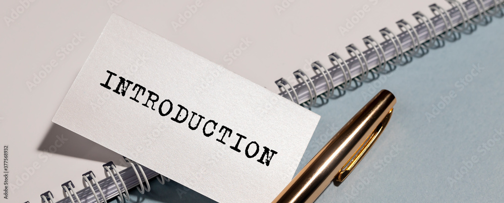 Word INTRODUCTION on paper on office desk Stock Photo | Adobe Stock