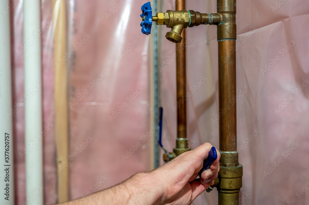 Lawn sprinkler shut off valve inside residential basement Stock Photo ...
