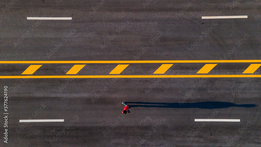 Long asphalt road with marking lines yellow stripes traffic on the road ...