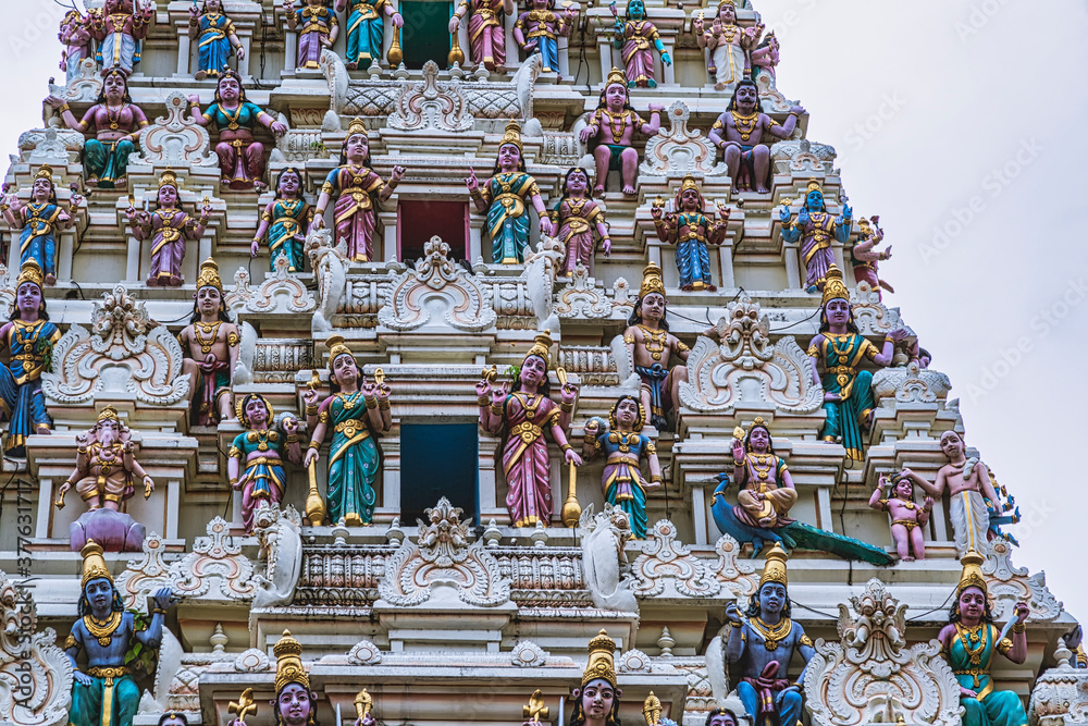 Foto de Hindu temple roof close-up of deities statues. do Stock | Adobe ...