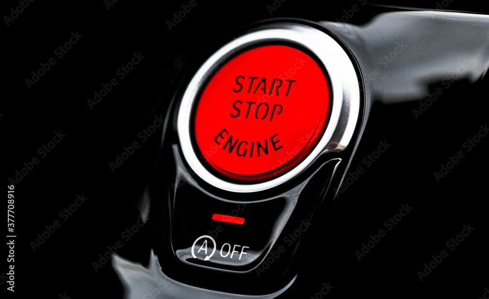 Foto Stock Car dashboard with focus on red engine start stop button ...