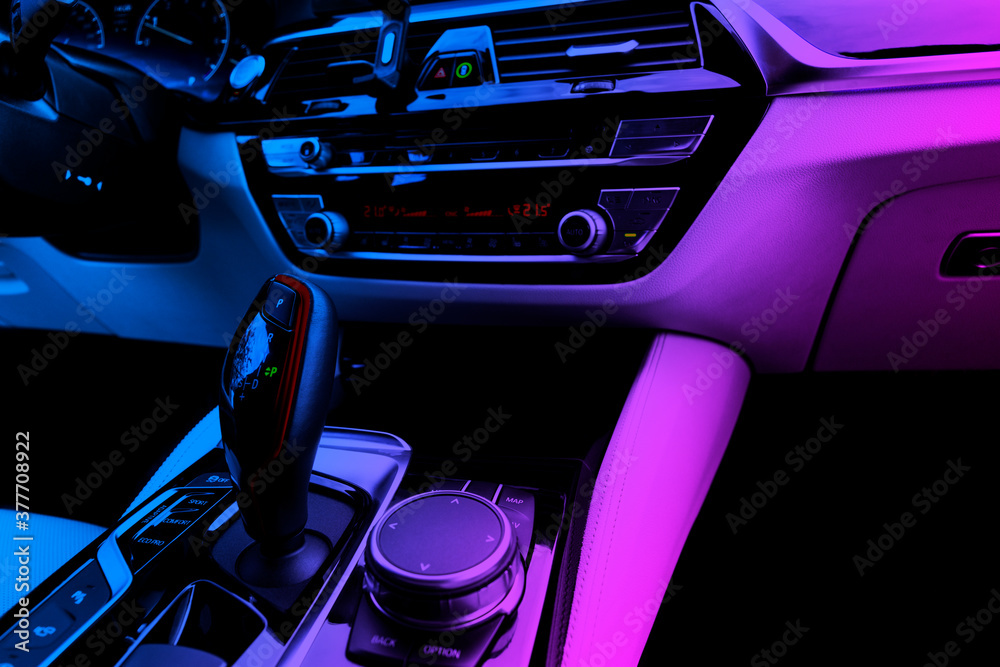 Modern luxury car white leather interior with in blue and pink tones ...
