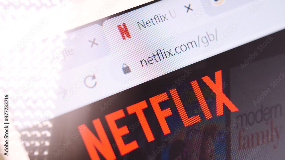Website of Netflix in browser and logo on the computer screen ...