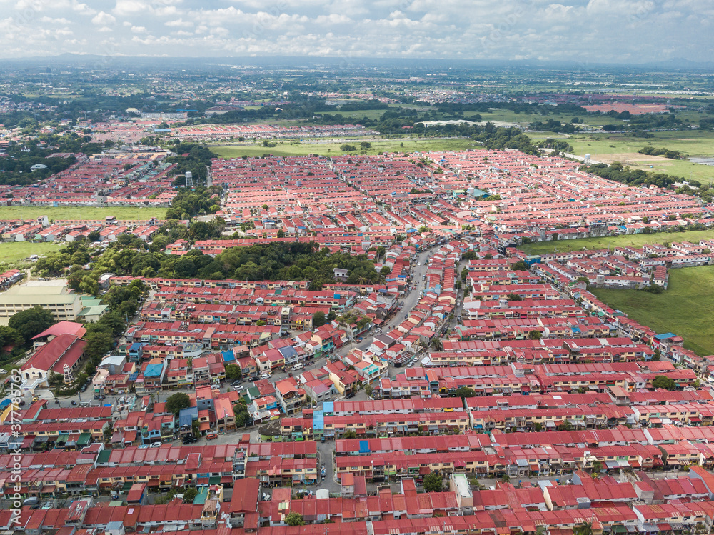 Aerial of a huge expanse of two storey row houses in Malagasang, Imus ...