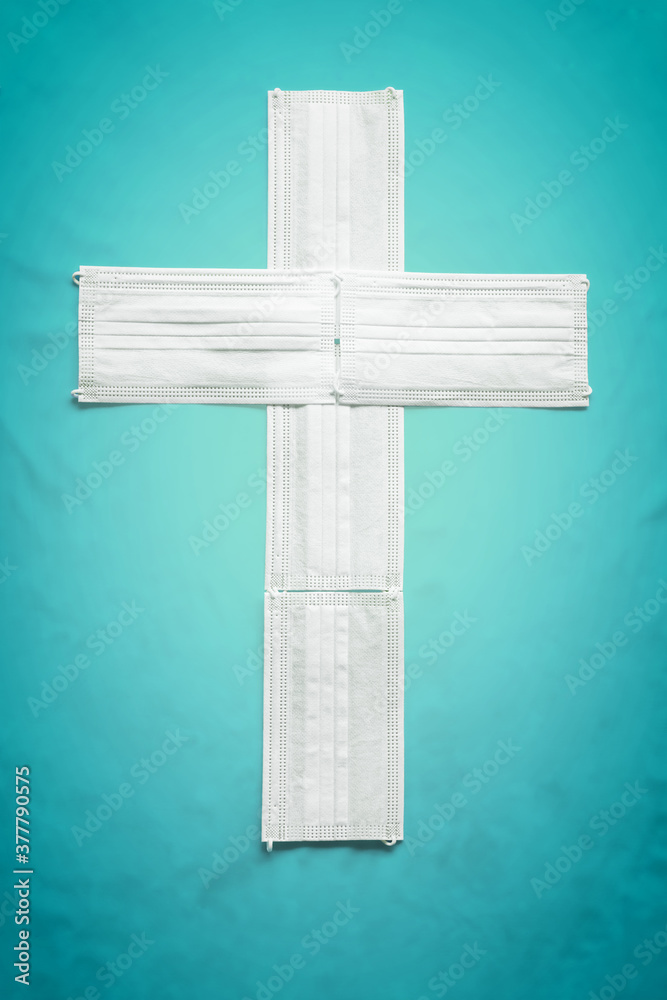 Covid-19, The Cross, Medical mask cross on blue background, blank ...