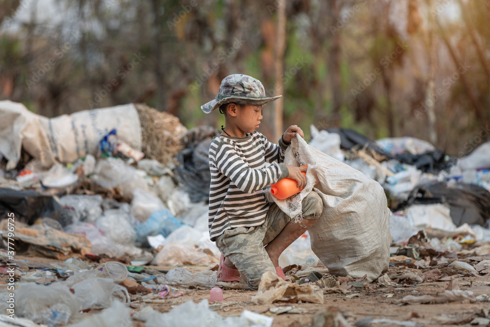 Child labor. Children are forced to work on rubbish. Poor children ...