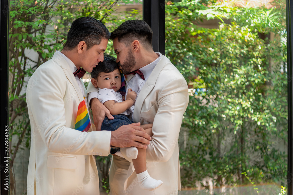 Young married LGBT couples celebrate a romantic moment together with ...