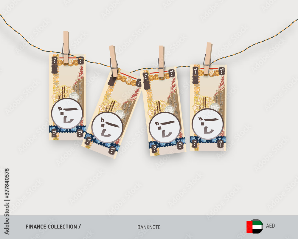 Wet 200 United Arab Emirates Dirham banknotes hanging on rope attached ...