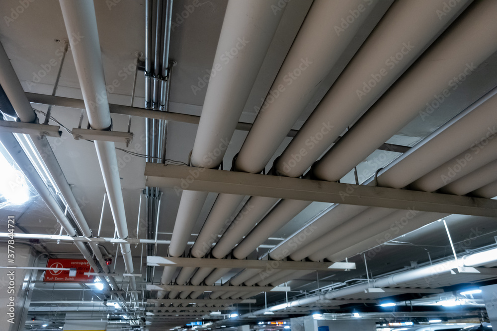 Underground piping service system in an office building car parking ...