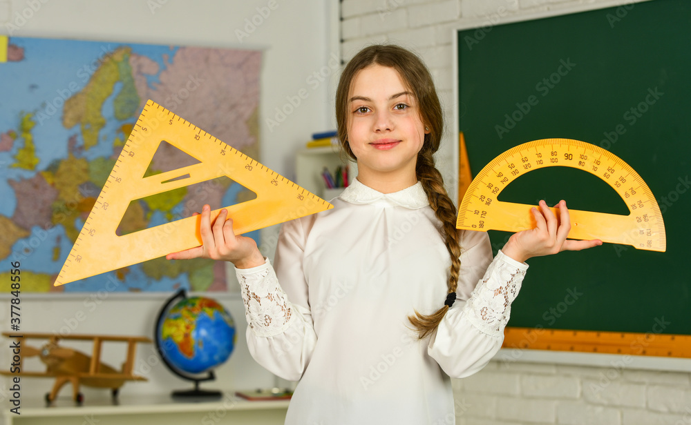 Geometry favorite subject. measure angles in degrees. Small child girl ...