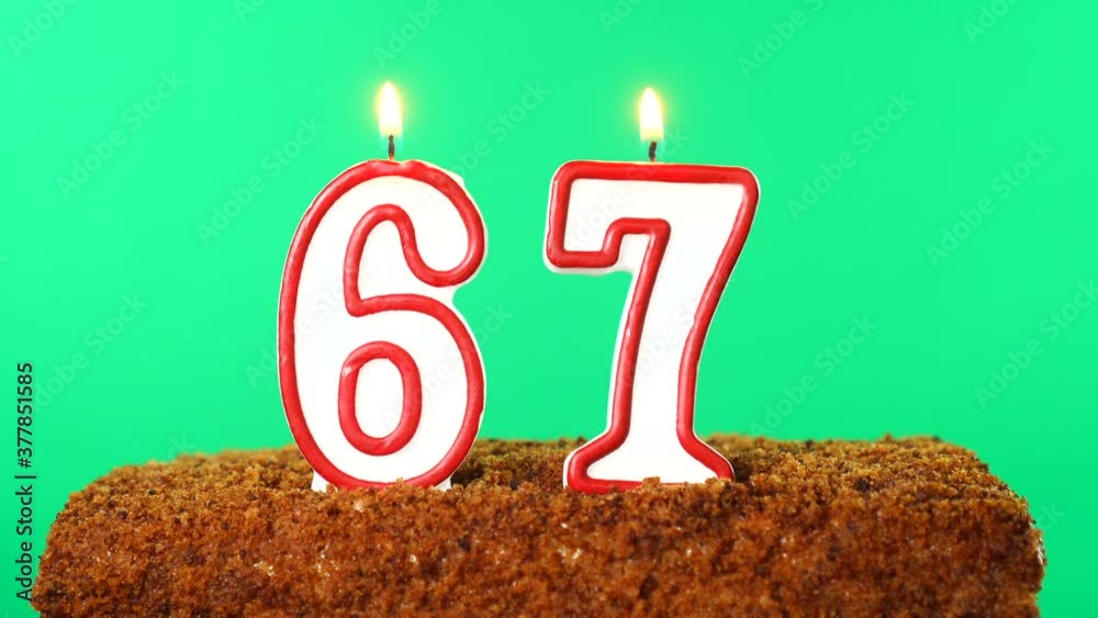 Cake with the number 67 lighted candle. Chroma key. Green Screen ...