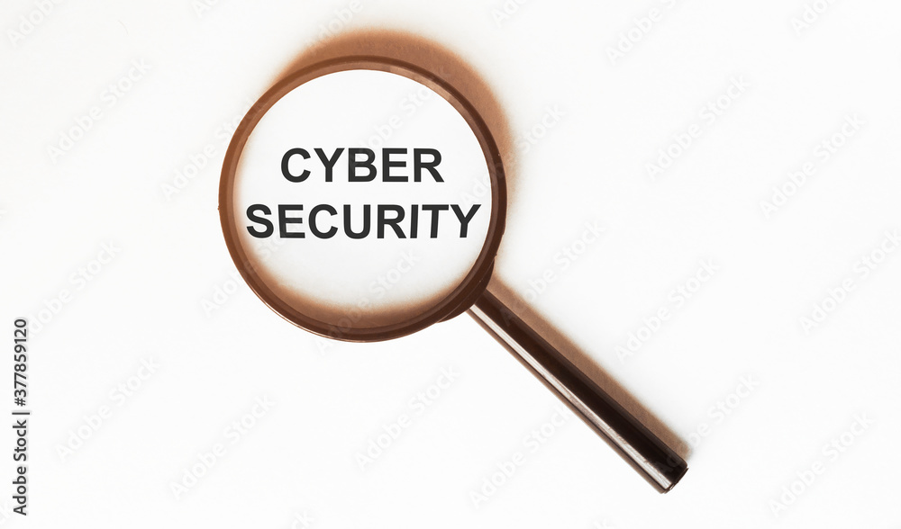 Cyber Security on a sheet under a magnifying glass Stock Photo | Adobe ...