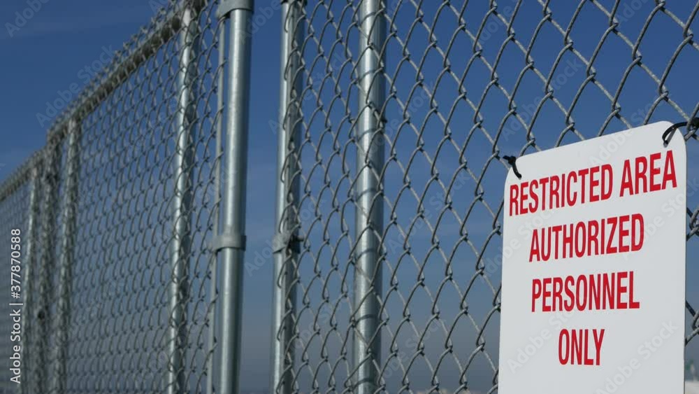 Restricted area, authorized personnel only sign in USA. Red letters ...