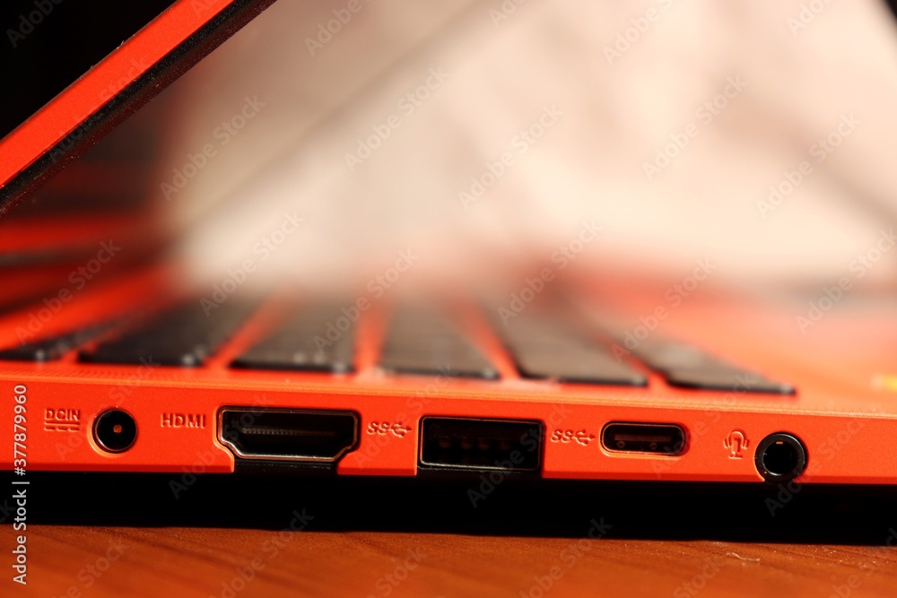 USB port on red laptop. There are hdmi, usb 3.0, usb type c. Stock ...