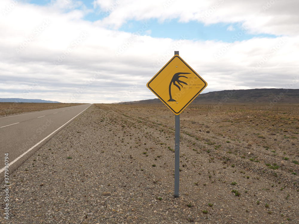Road sign warning of strong wind in a roadside of desert Stock Photo ...