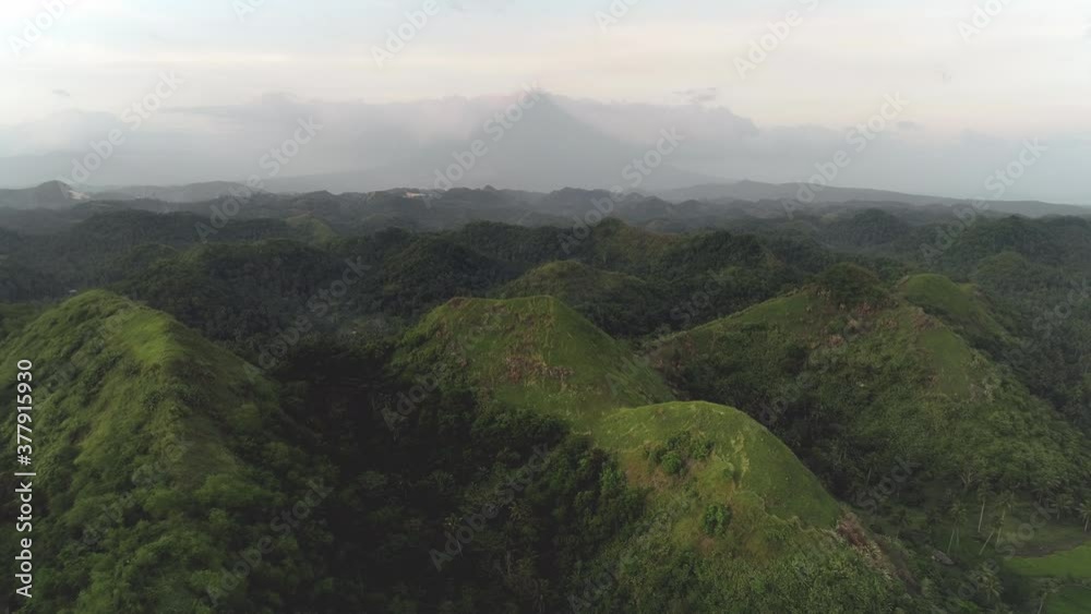 Asia rainforest hills aerial: Mayon volcano at Legazpi town ...