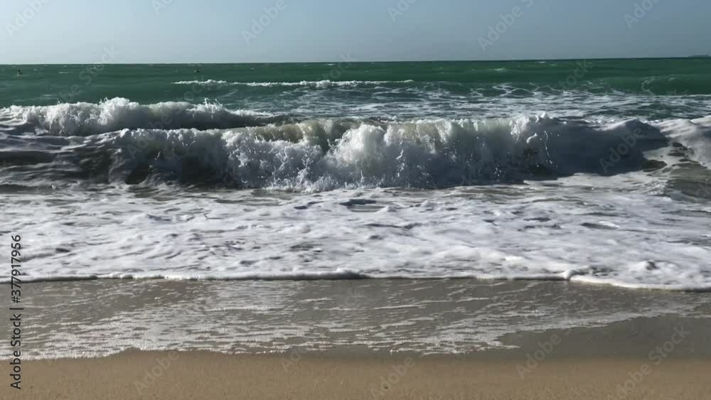 Persian Sea waves rolling on sand at Kite Beach in Dubai,UAE.Popular ...