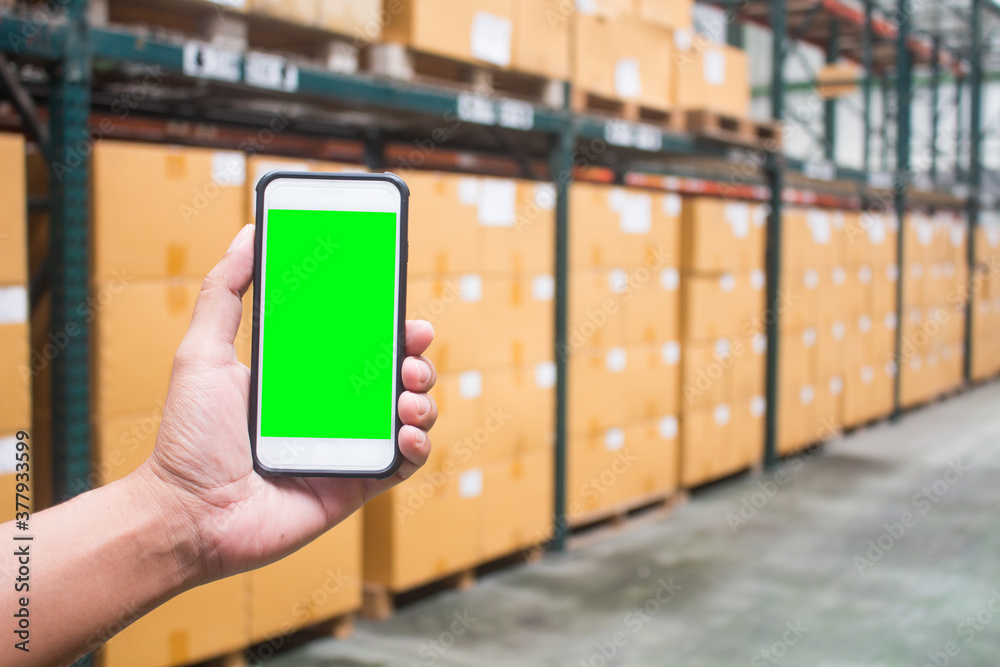Free space on the smartphone screen with warehouse background, For your ...