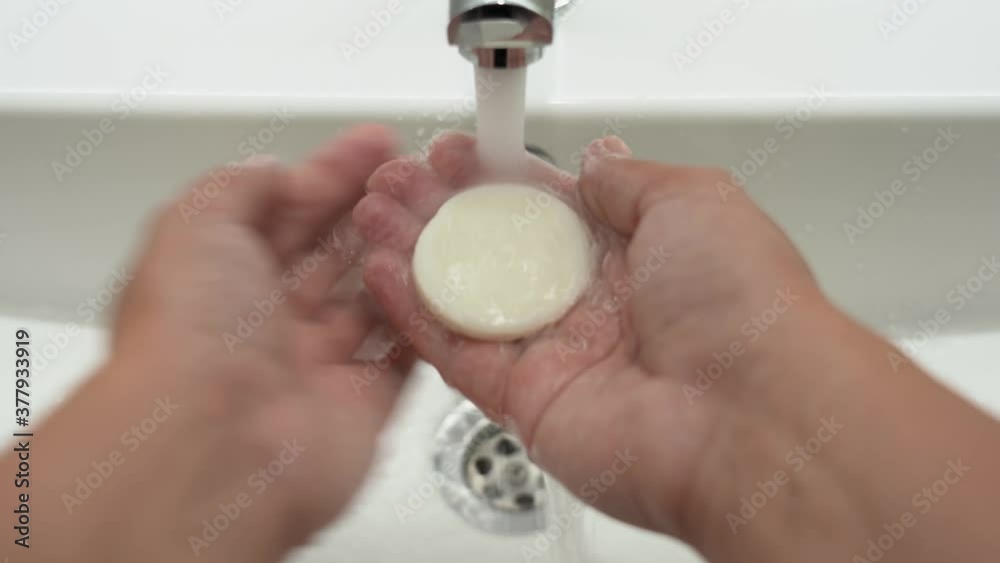 Closeup point of view 4k video of two female hands holding small round ...