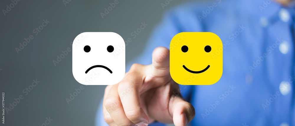 Client's hand pointing the happy face smile face icon, Rating for a ...