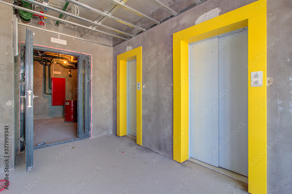 Corridor of new residential building under construction view ...