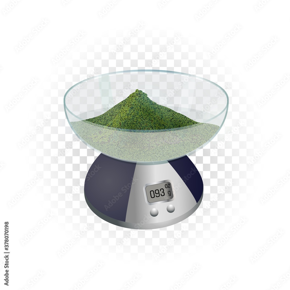 Silver weight scale with ground green spice powder in transparent bowl ...