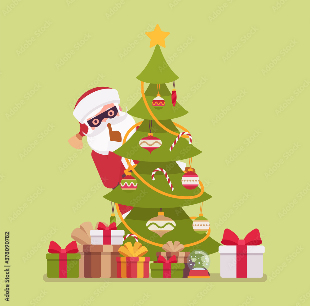 Secret Santa Claus wearing mask hiding behind a christmas tree ...