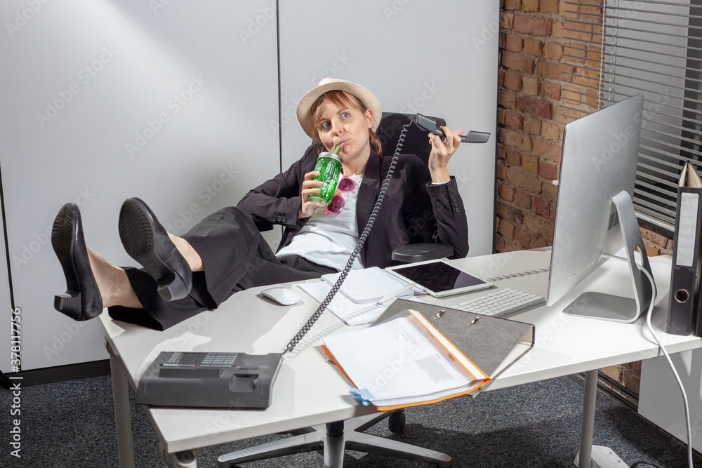 Young female office worker trying to escape from her stressful projects ...