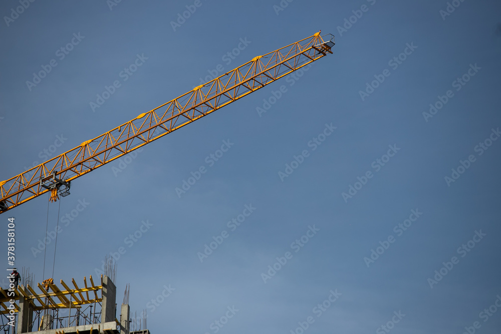 Preparing to pour a bucket of concrete into formwork.Tower crane ...