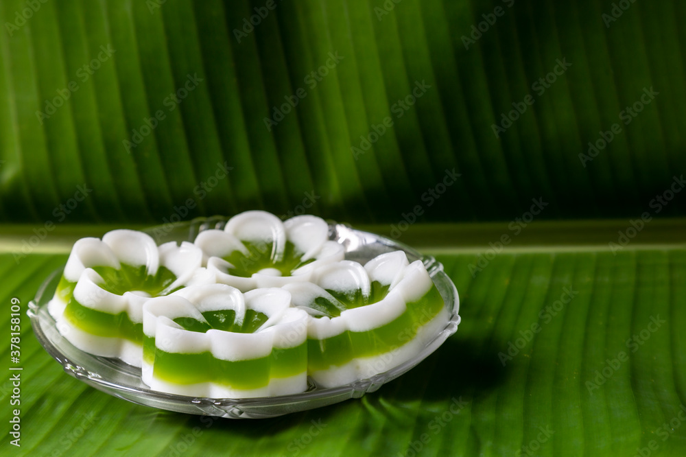 Pandan coconut jelly in a plate on fresh green banana leaves Stock ...