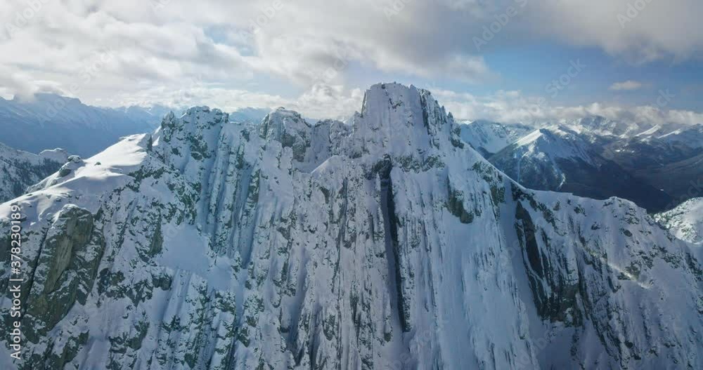 Wide aerial, snowy mountain ridge in Banff National Park Stock Video ...