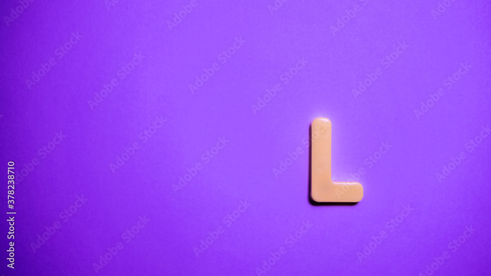letter of the anguilla alphabet on a pink background Stock Photo ...
