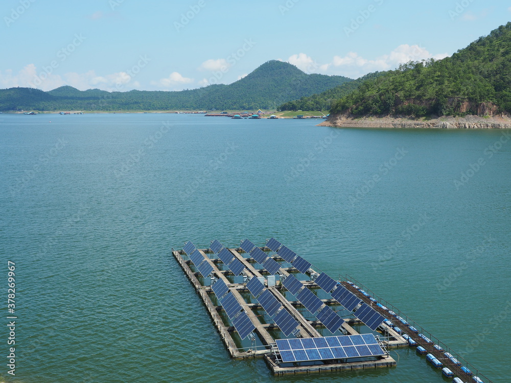 Floating solar panel on the lake with mountain background. This ...