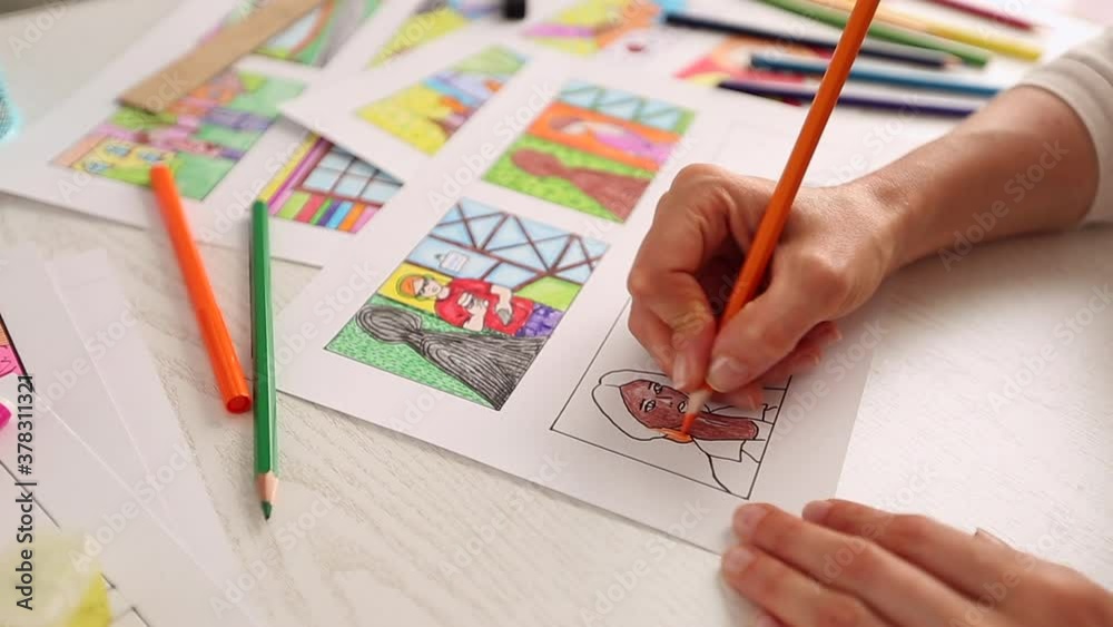 The animator artist draws in pencil a color storyboard for the cartoon ...