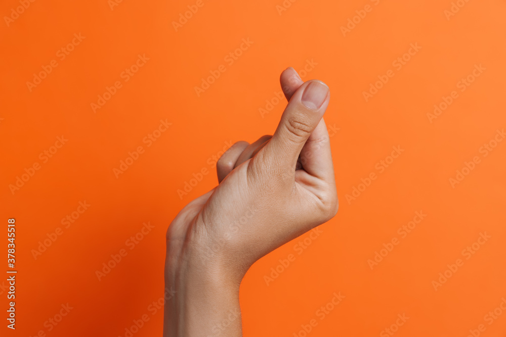 Woman's hand showing clicking gesture Stock Photo | Adobe Stock