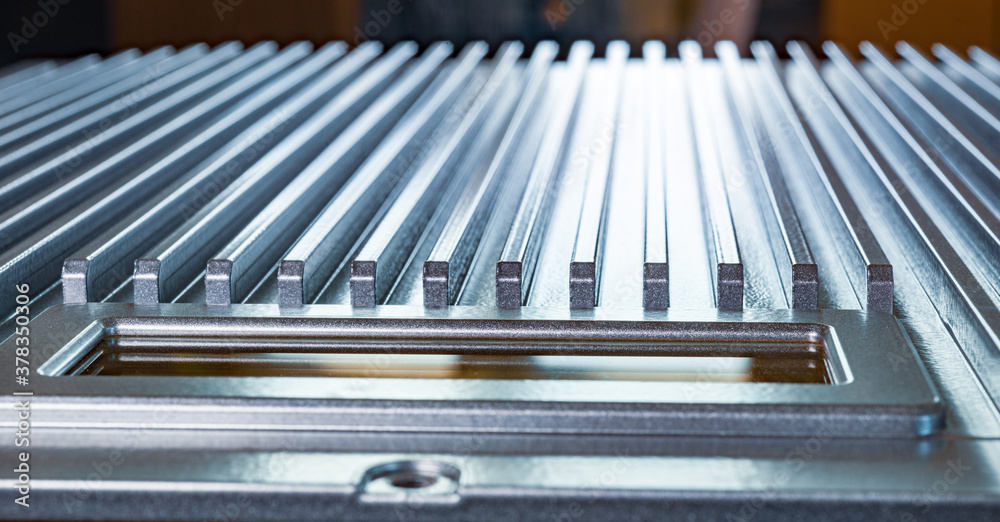 Fluted metal surface next to a control panel Stock Photo | Adobe Stock